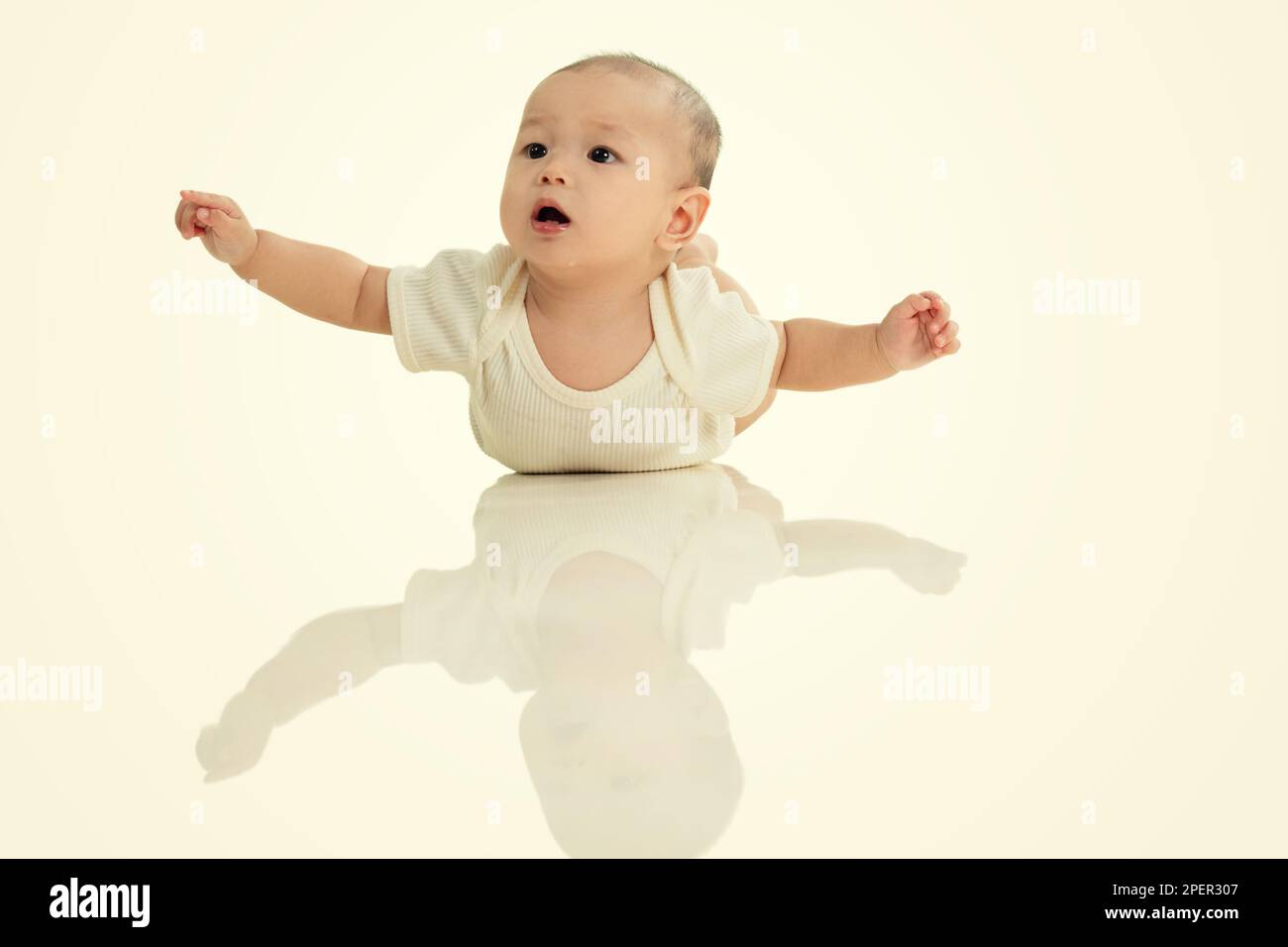 Lovely baby play prone on the floor Stock Photo - Alamy