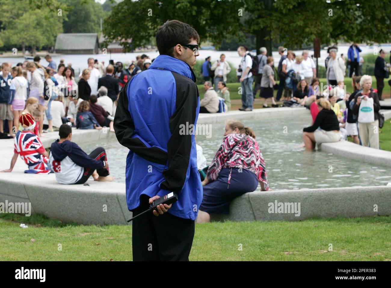 A security guard watches as hundreds of people turn up to enjoy the re ...