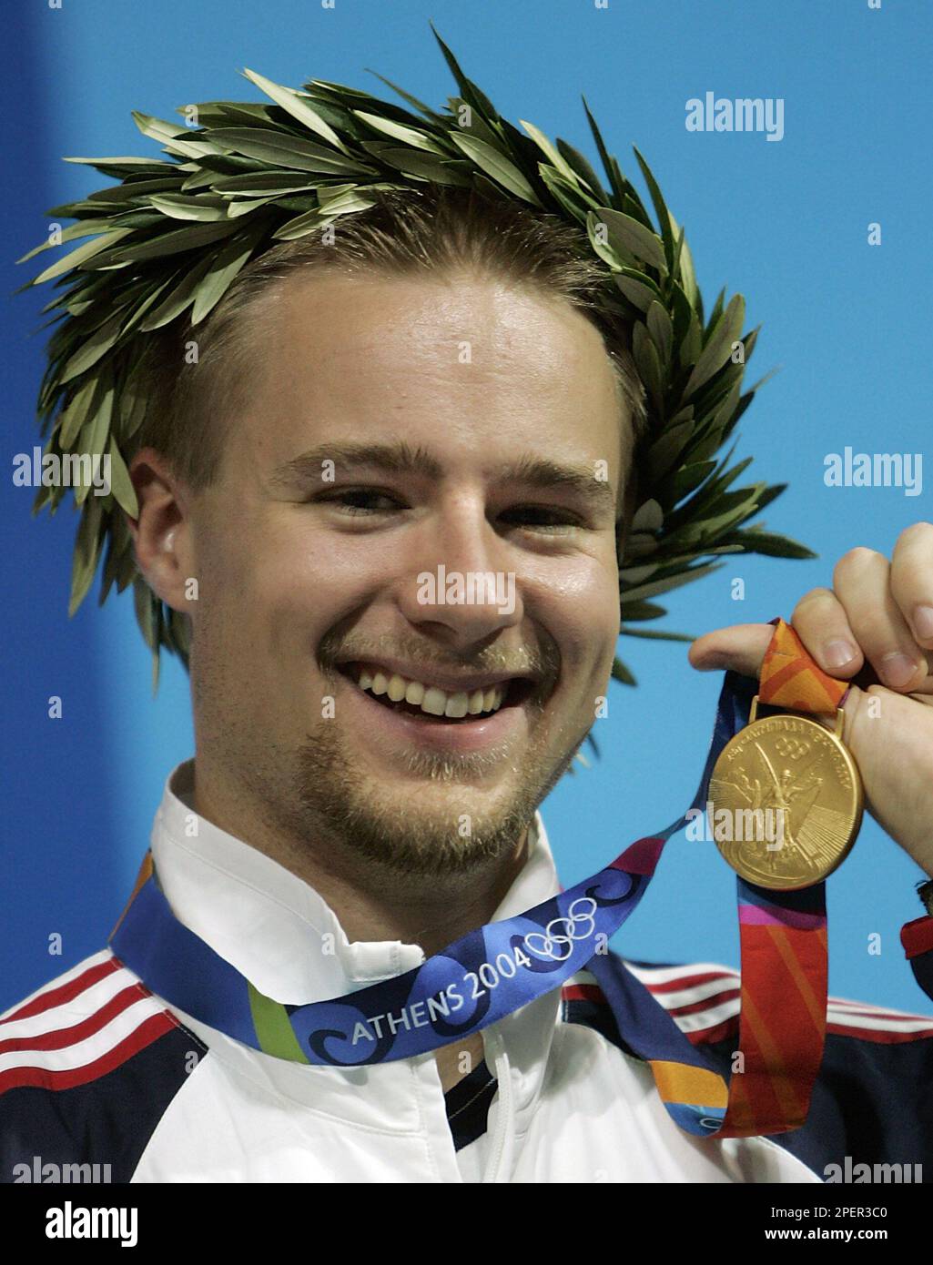 USA's Matthew Emmons displays his gold medal for the Men's 50m rifle ...