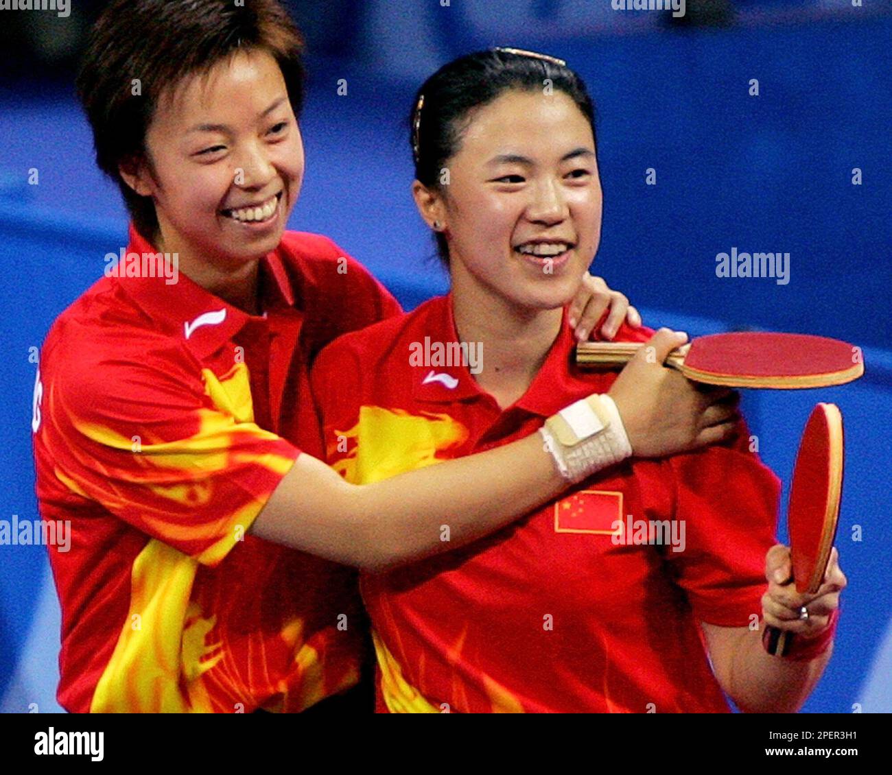 China's Zhang Yining, left, and Wang Nan celebrate after defeating ...