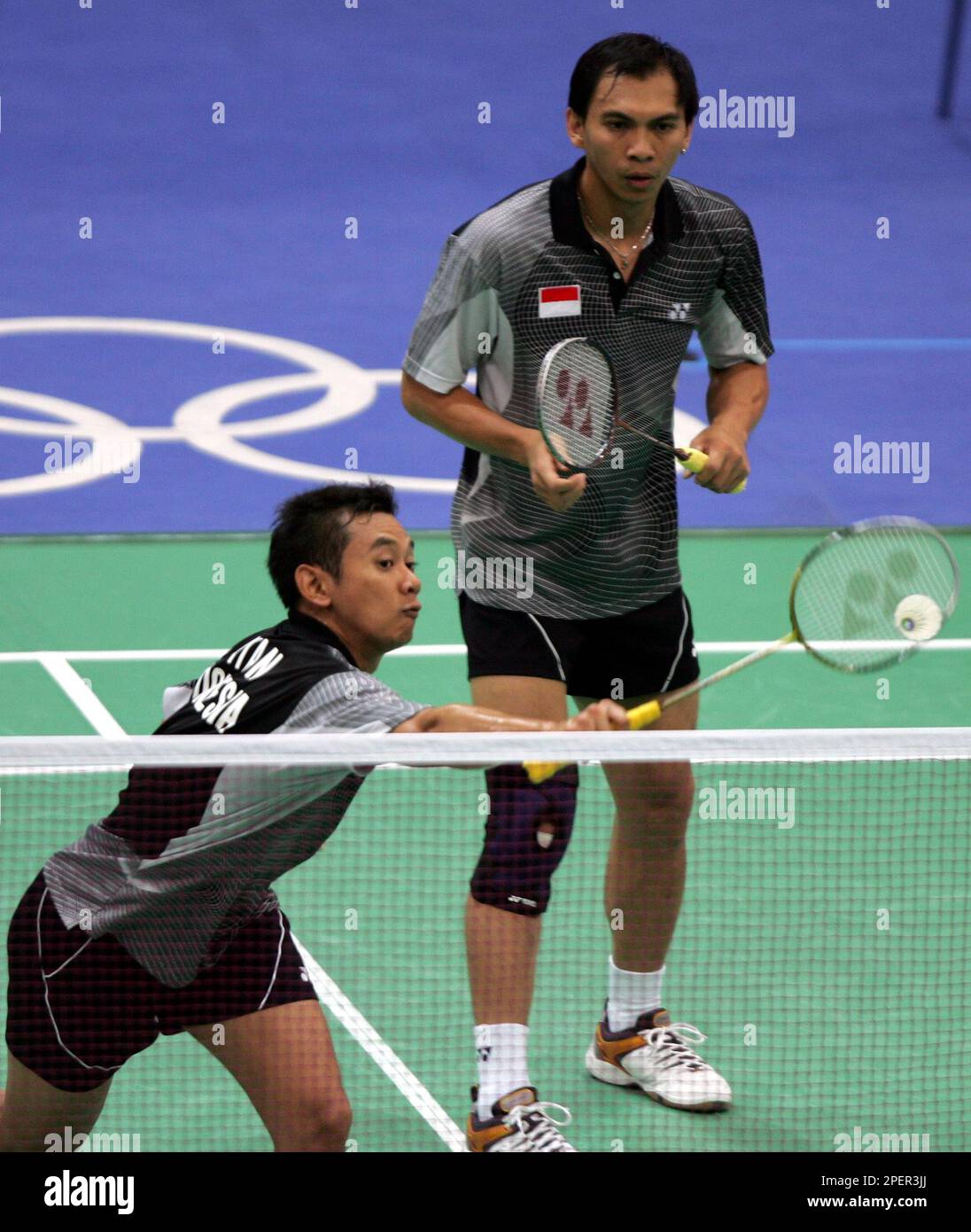 Indonesia's double player Eng Hian, left, returns to Jens Eriksen and ...