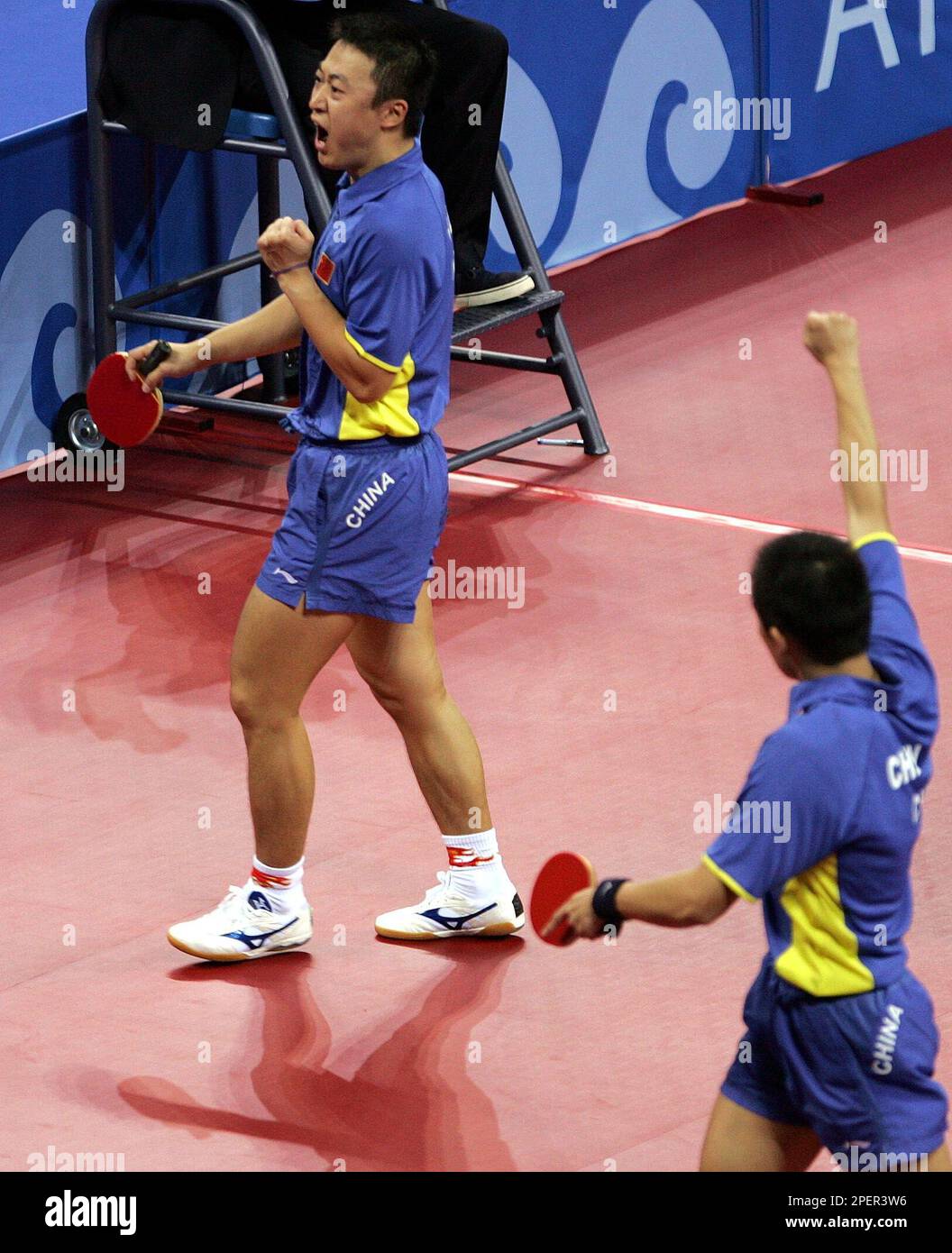 China's Ma Lin, left, celebrates with temmmate Chen Qi after scoring a ...