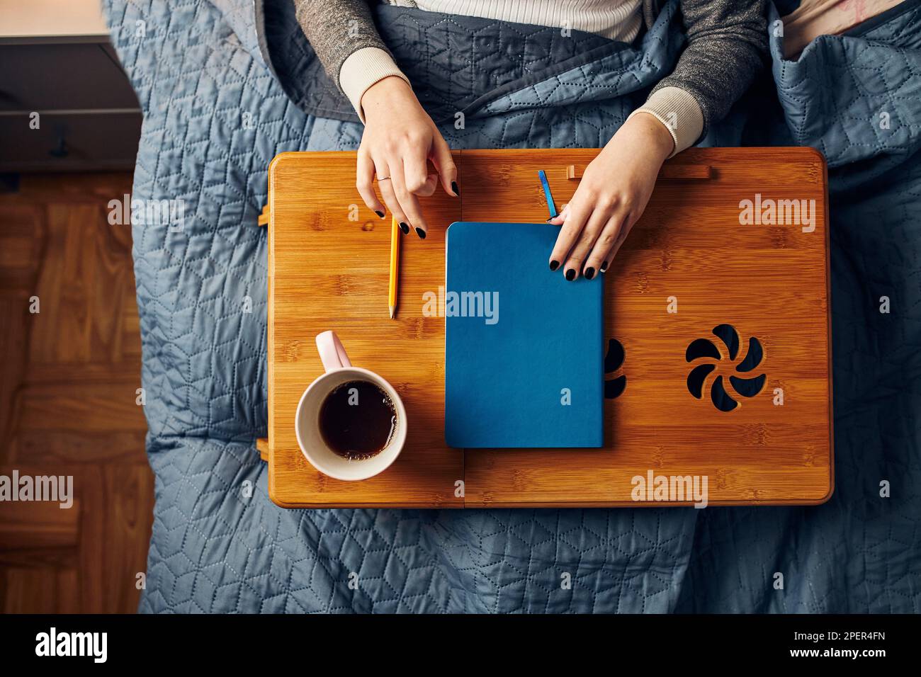 Young woman opening diary, writing journal. Making notes in diary ...