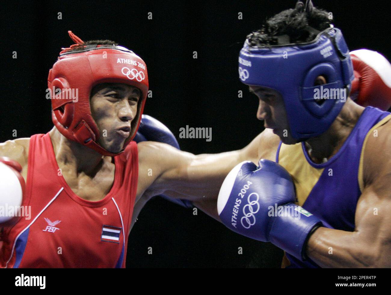 Thailand's Boonjumnong Manus, left, exchange punches with Philippines ...