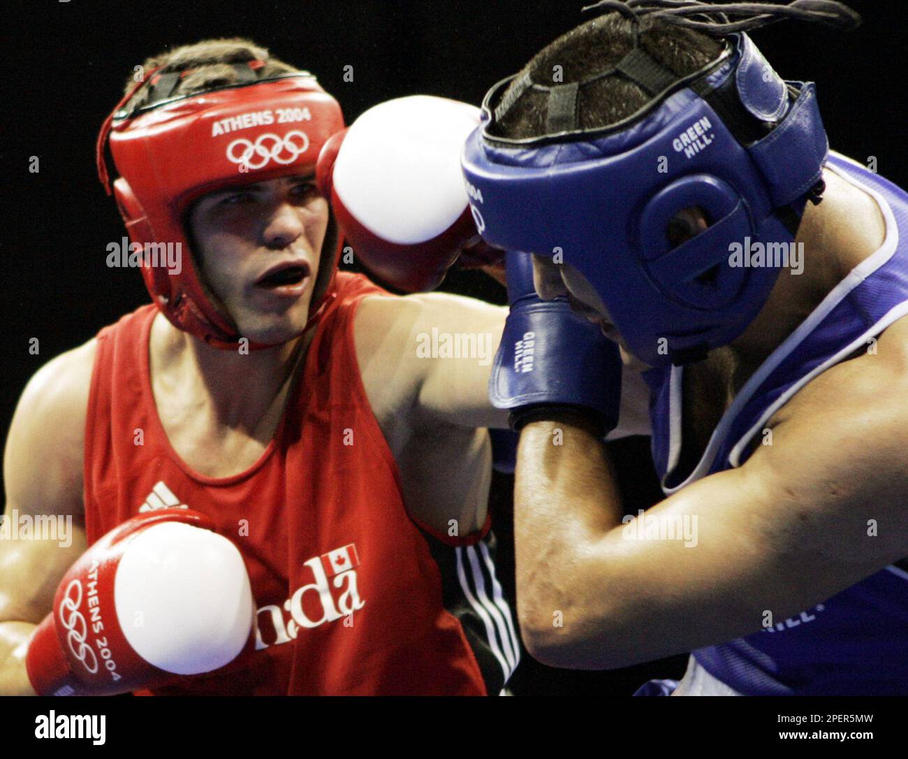 Canada's Trevor Stewardson, left, throws a punch on Egypt's Ahmed ...
