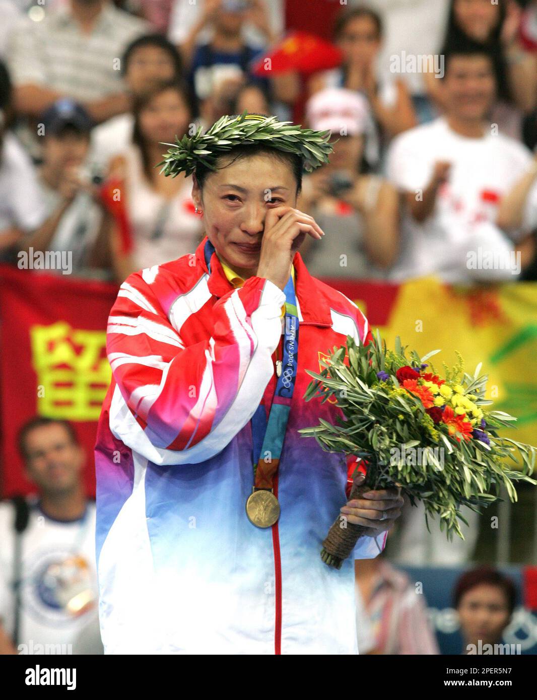 China's Zhang Ning fights back tears as she listens to the Chinese ...
