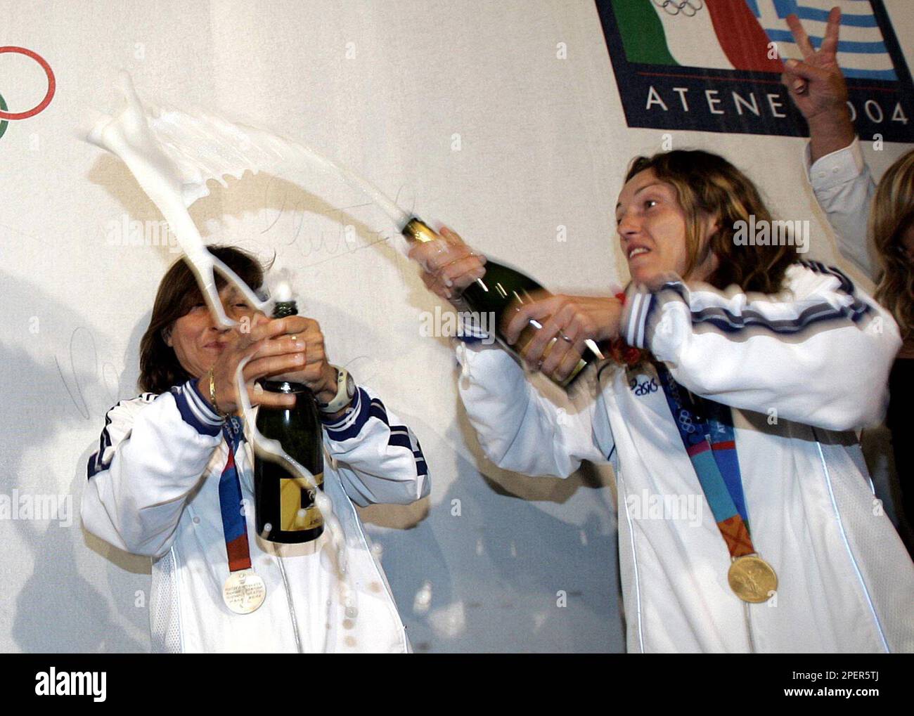Italy's gold medalist Valentina Vezzali, right, and silver medalist ...