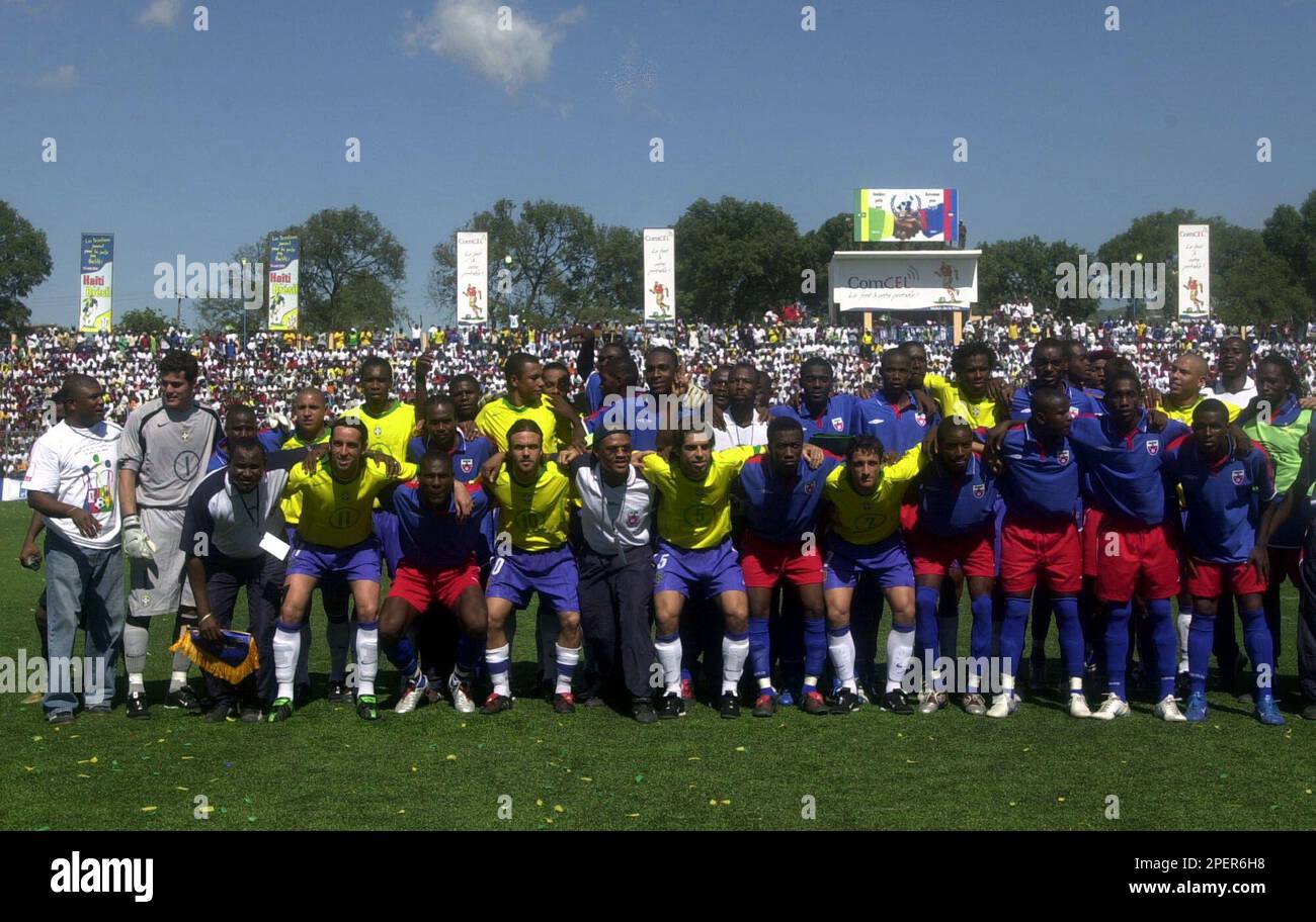 Brazilian and Haitian players pose for photographers before a friendly ...