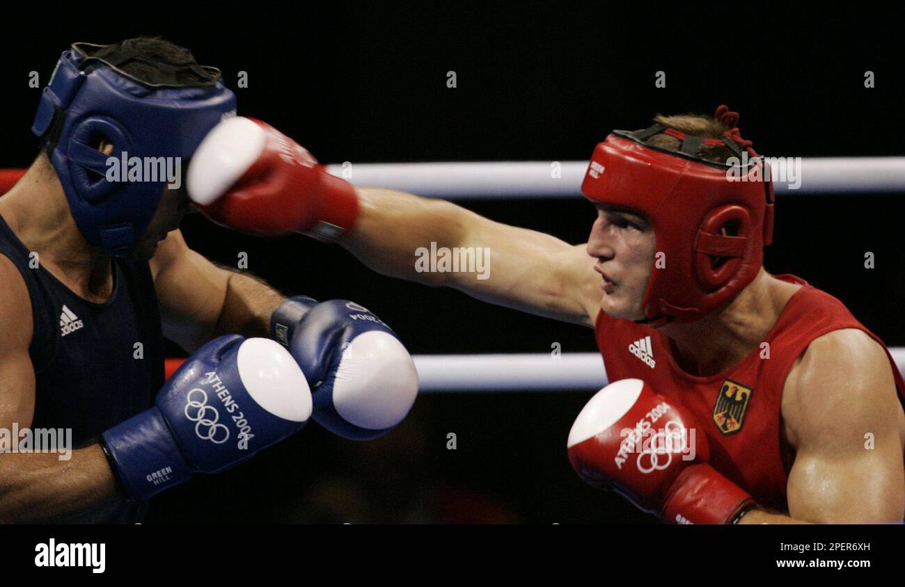 Germany's Sebastian Koeber, right, reaches out a blow on Kazakstan's ...