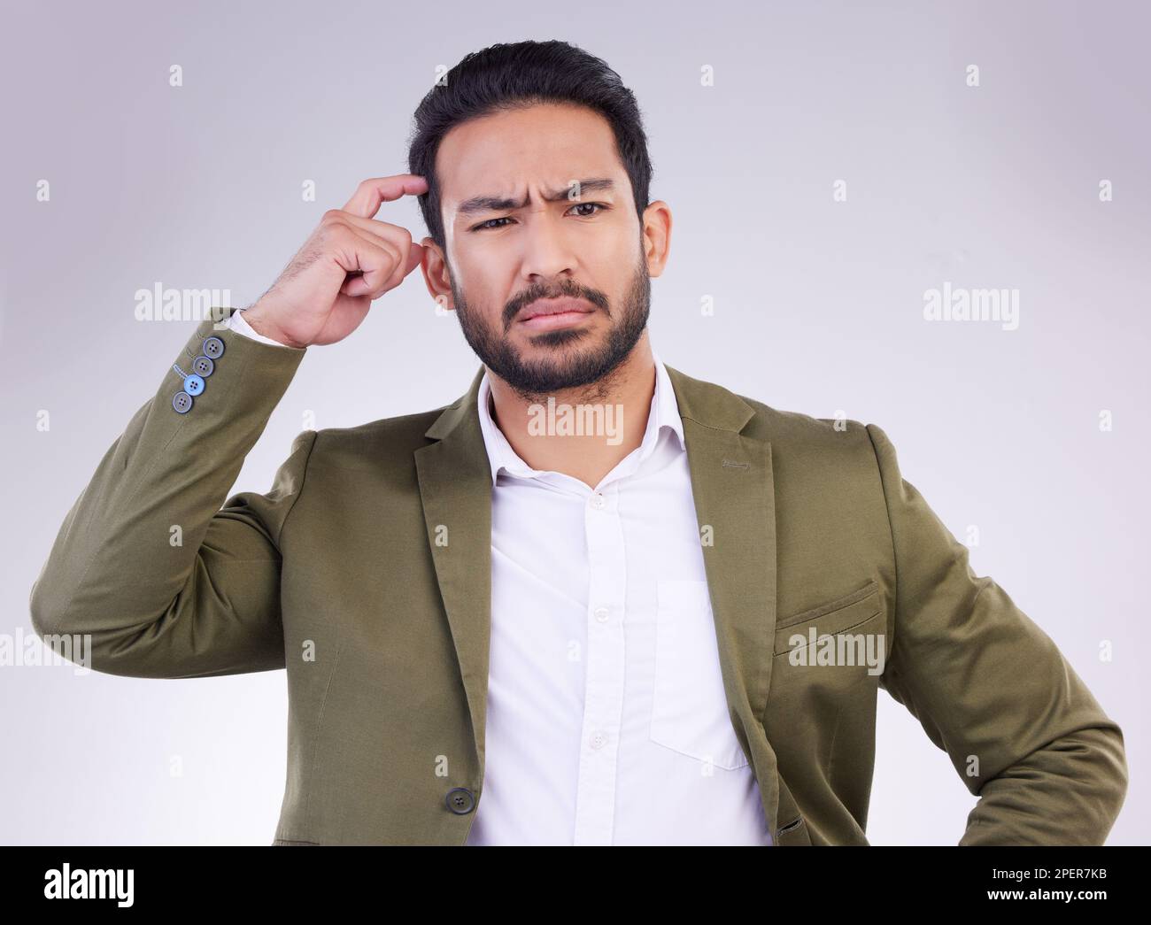 Confused, decision and an Asian man thinking with a gesture isolated on ...