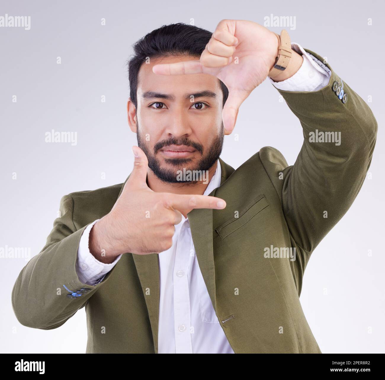 Finger framing, portrait and business man in studio, background or ...