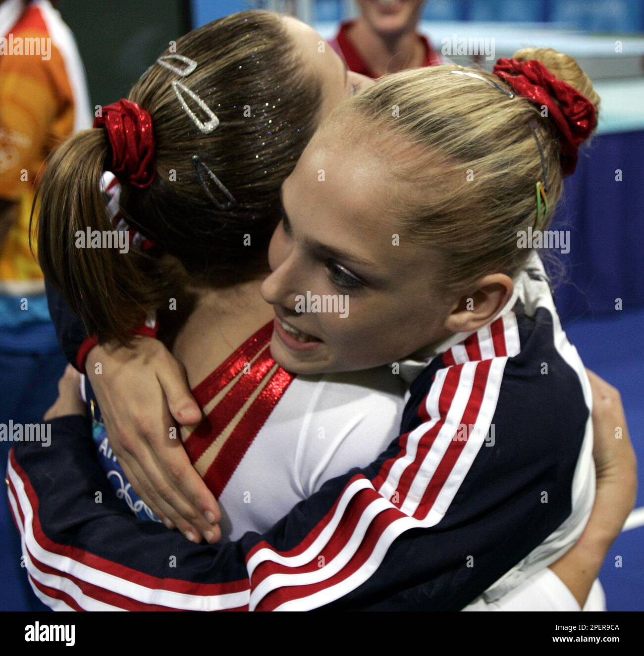 Courtney McCool, right, hugs teammate Carly Patterson after the USA won ...