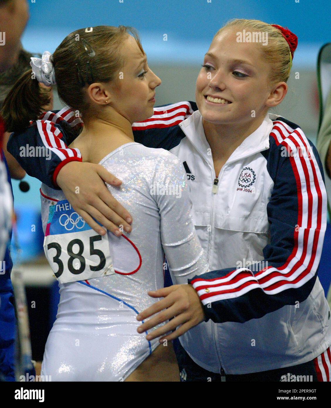 United States' Courtney McCool, right, congratulates Romania's Nicoleta ...