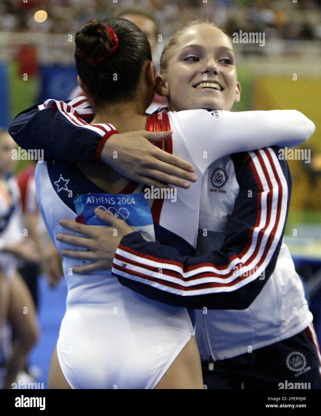 Courtney McCool of the United States, right, hugs teammate Mohini ...