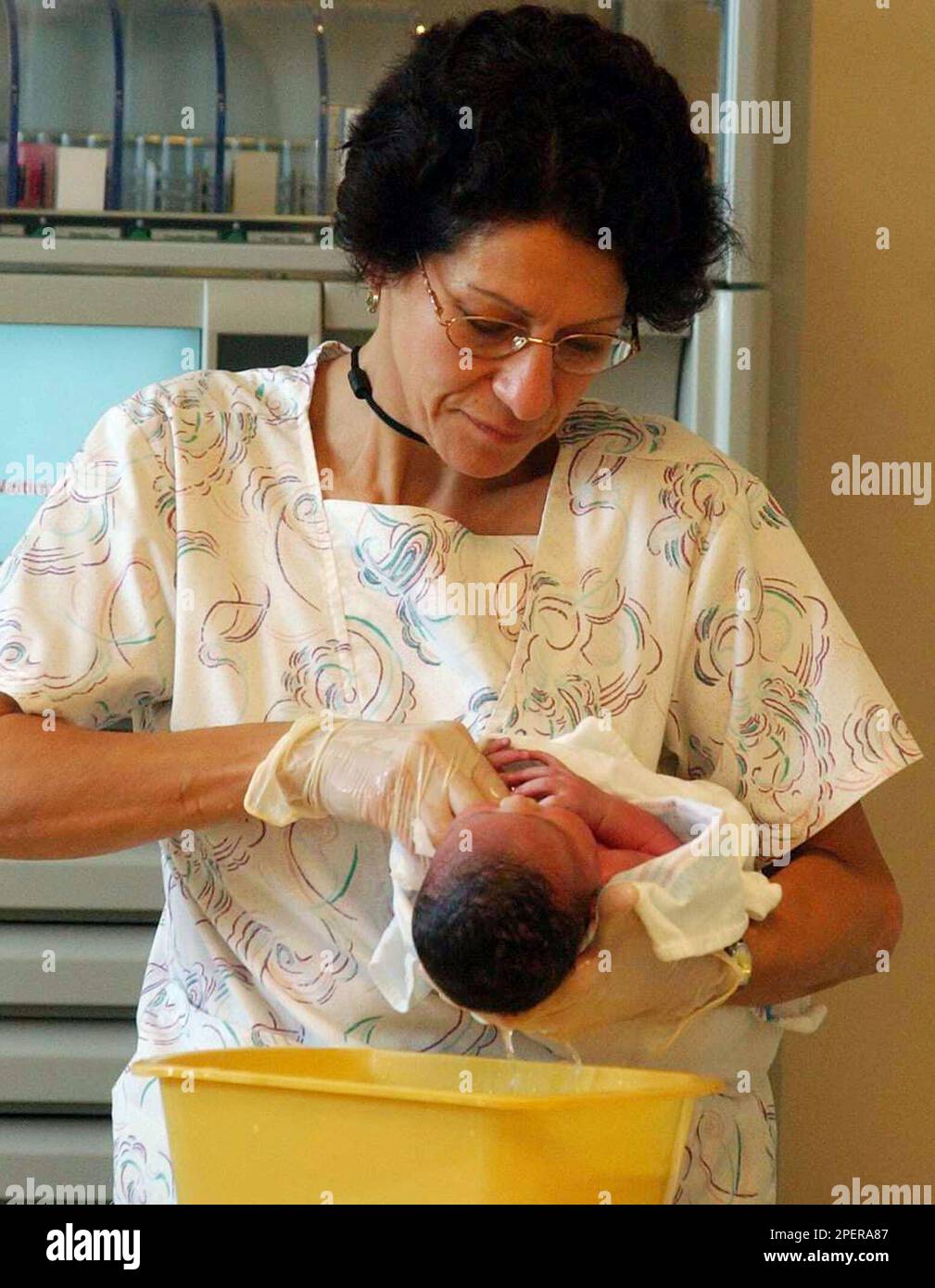 Gladys Colon bathes a newborn in the South Jersey Regional Medical ...