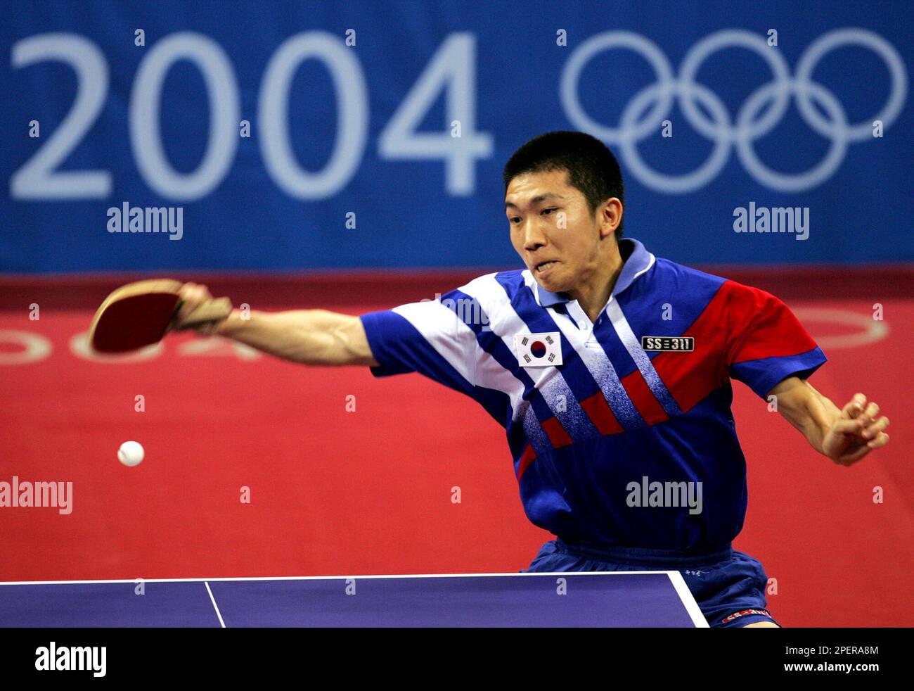 South Korea's Ryu Seung Min returns the ball against Japan's Koji ...