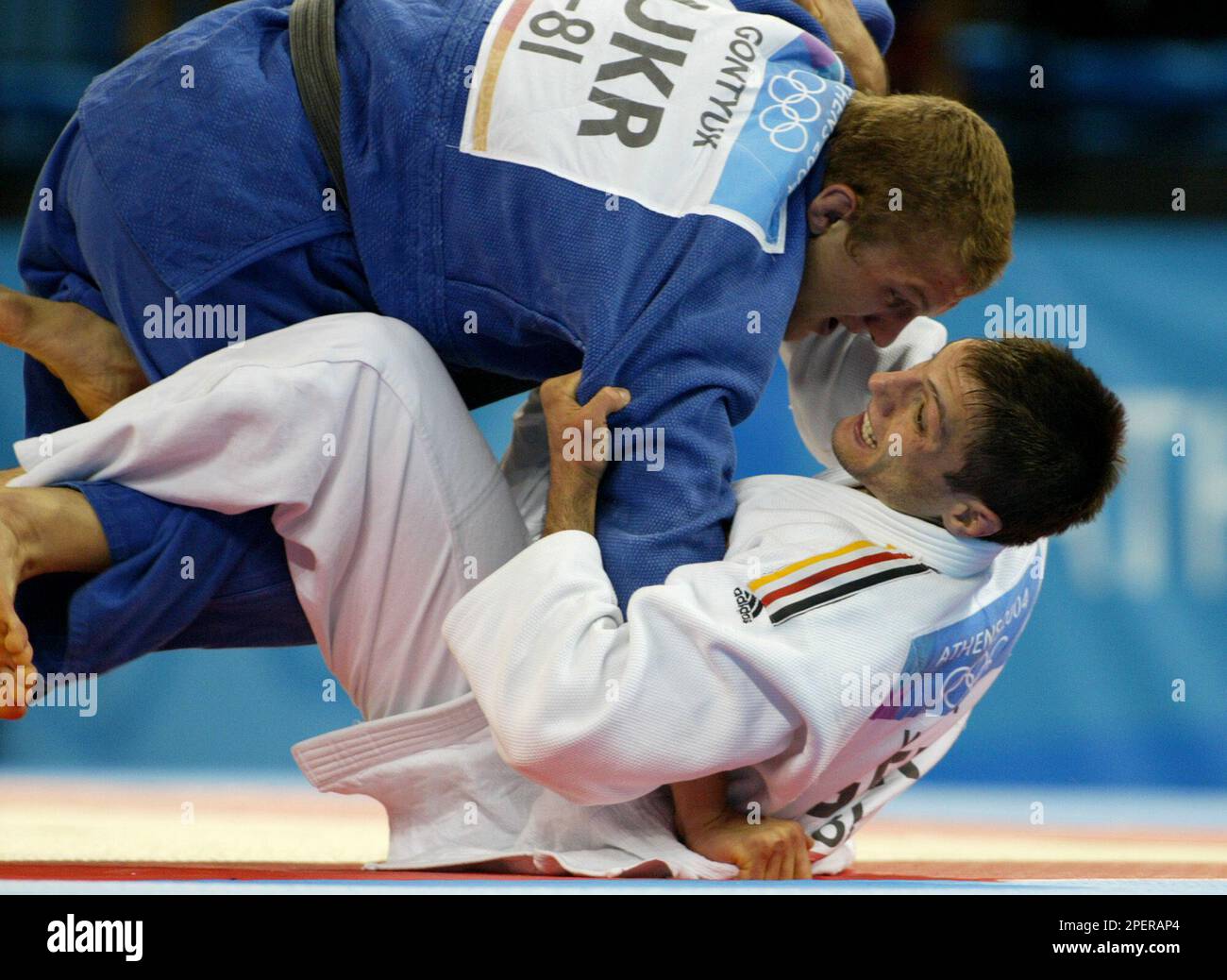 Roman Gontyuk, of Ukraine, top, beats Florian Wanner, of Germany, during the Judo Men half ...