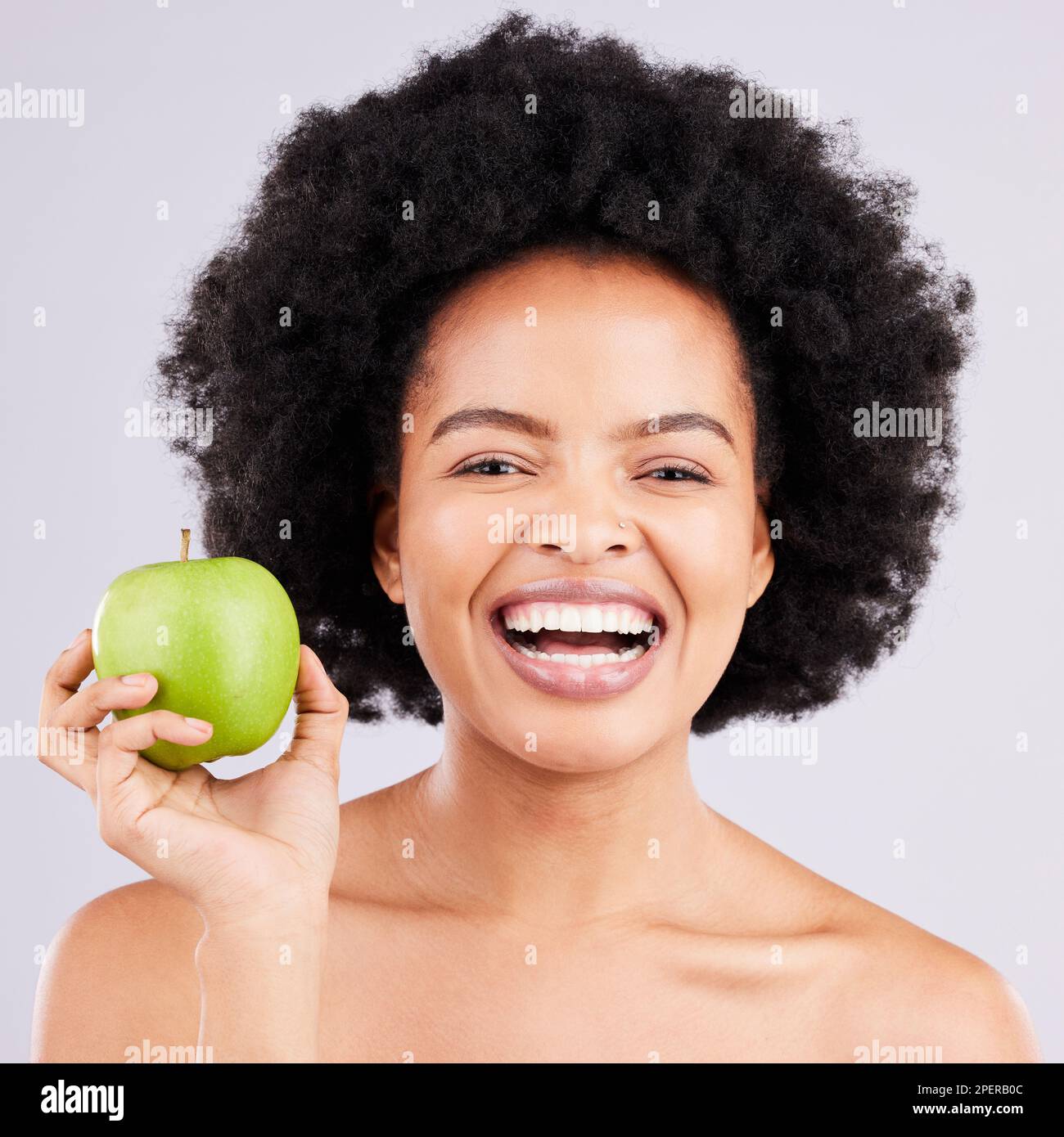 Portrait, health and black woman with apple, diet and happiness against ...