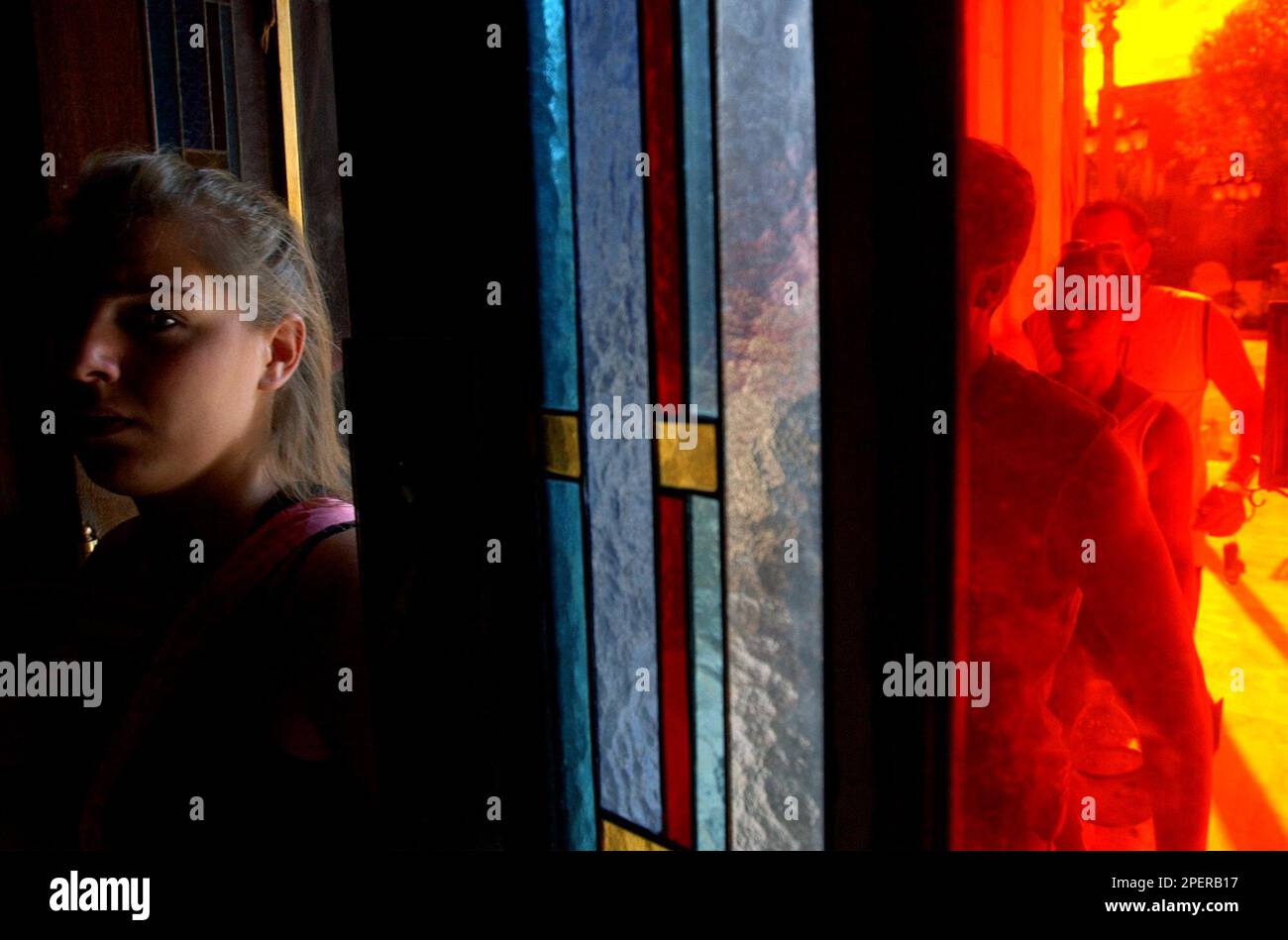 An unidentified tourist enters Athens' Orthodox Cathedral as other ...