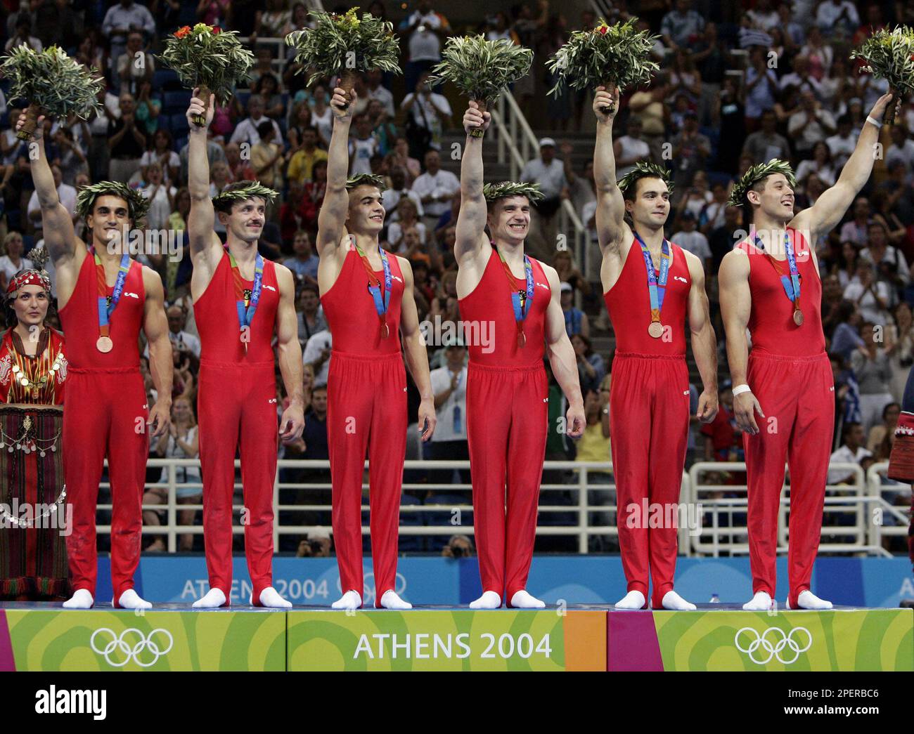 Romania's men's gymnastics team celebrates with their bronze medals ...