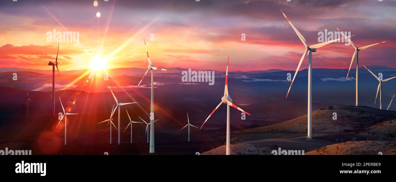 Wind Turbines At Sunset In Rural Mountain Landscape With Light Flare ...