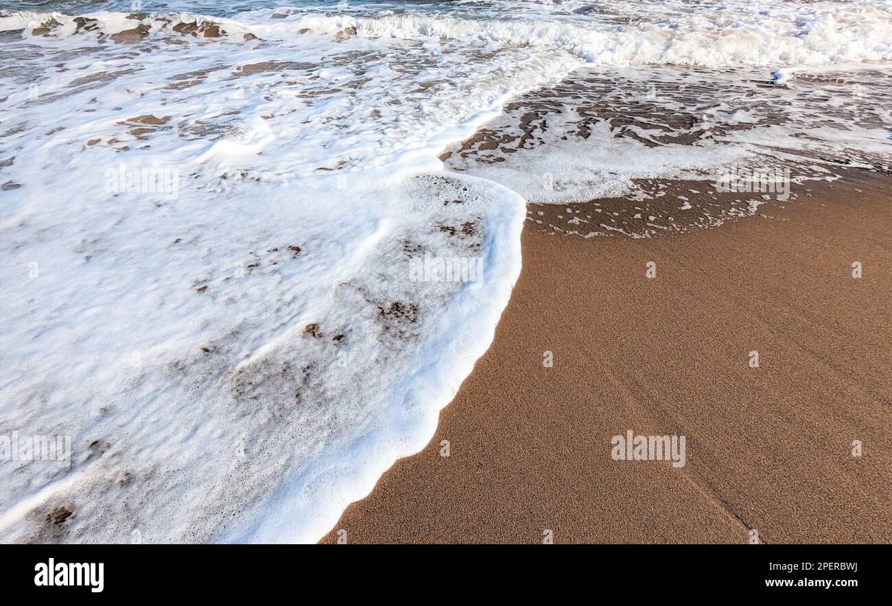 Surf and sand Stock Photo - Alamy