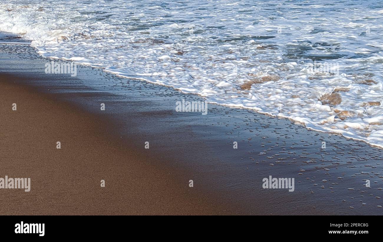 Surf and sand Stock Photo - Alamy
