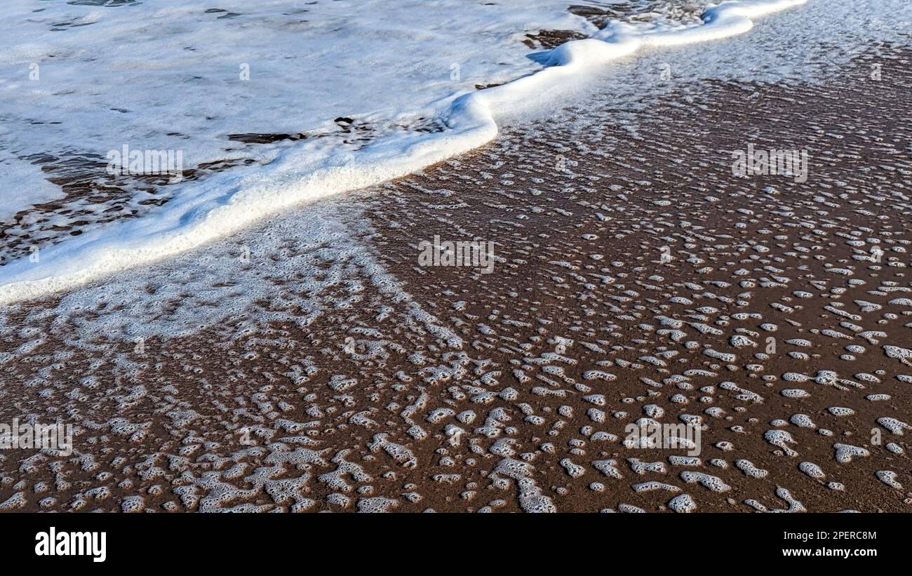 Surf and sand Stock Photo - Alamy