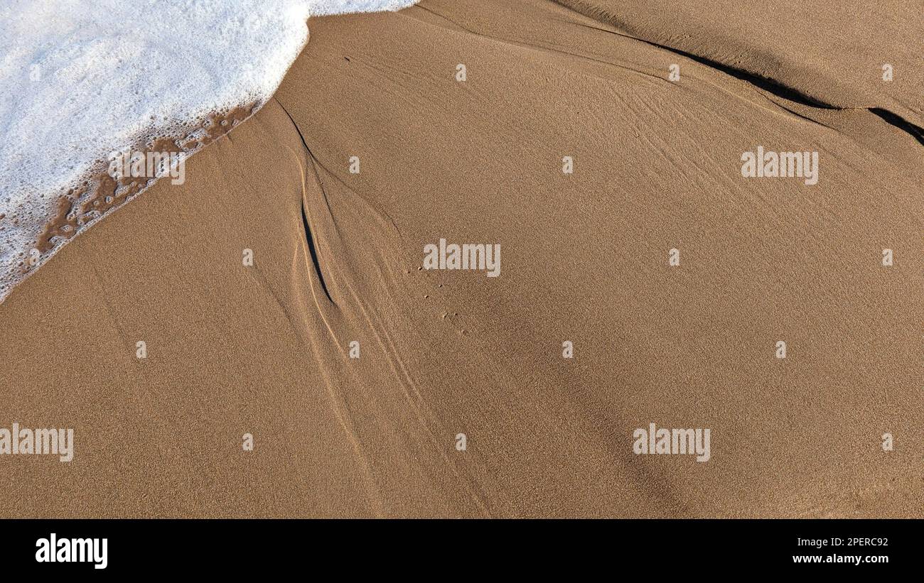 Surf and sand Stock Photo - Alamy