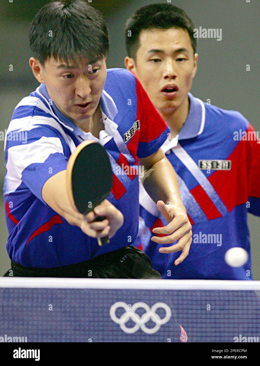 Oh Sang Eun of South Korea, left, returns the ball as his teammate Joo ...