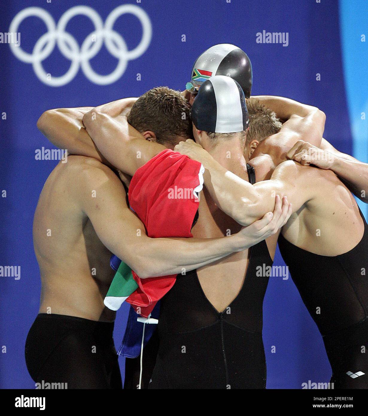 South African swimmers embrace after winning the 4x100m freestyle relay ...