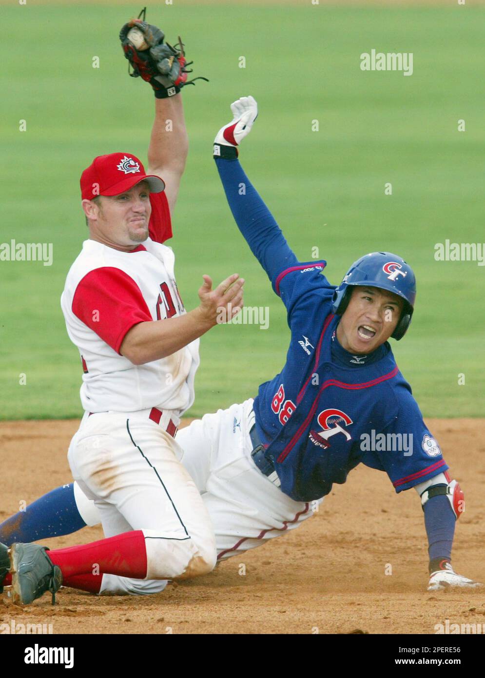 Canadian second baseman Richard Clapp tags out Chinese Taipei's Chao ...