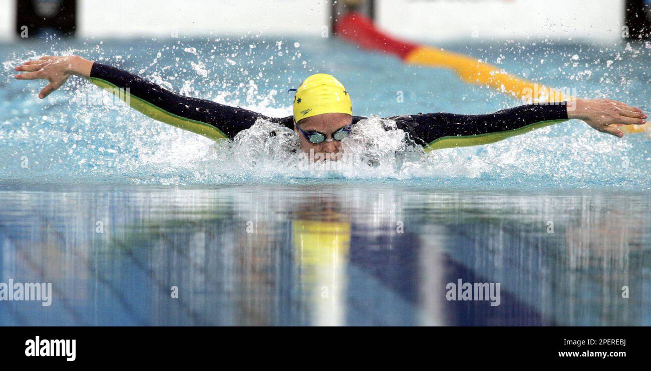 Petria Thomas, of Australia, swims to a gold medal in the 100-meter ...