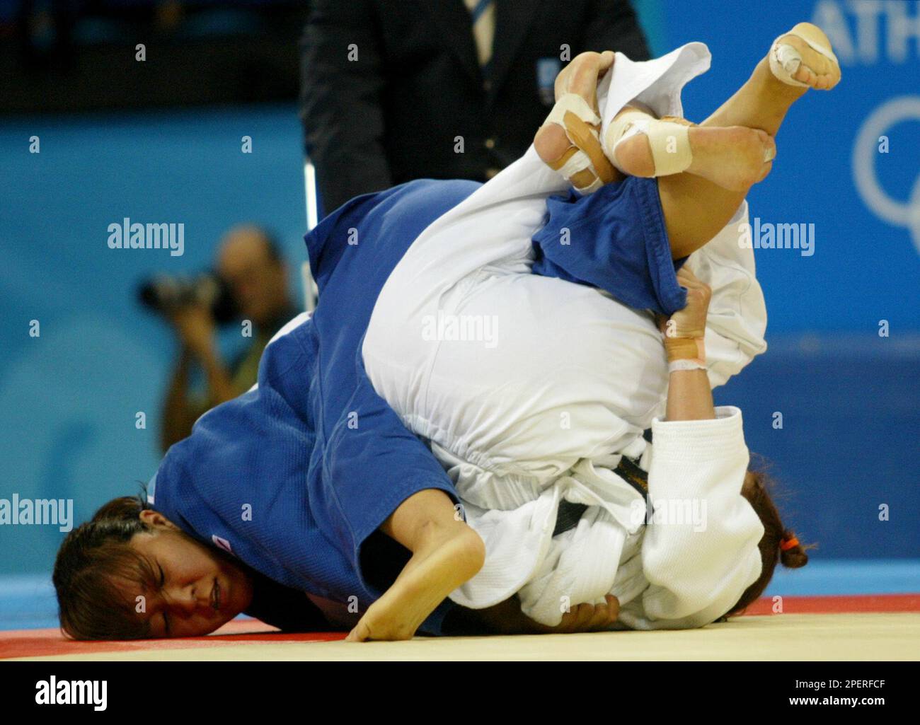 Yokosawa Yuki, of Japan, left, struggles with Greas Britain's Georgina ...