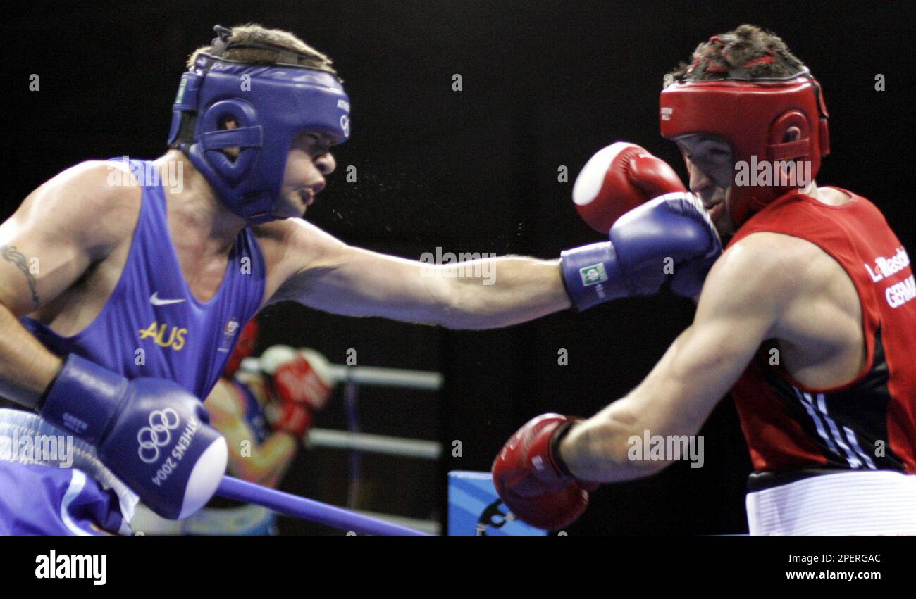 Australia's Jamie Pittman, left, lands a blow on Germany's Lukas ...