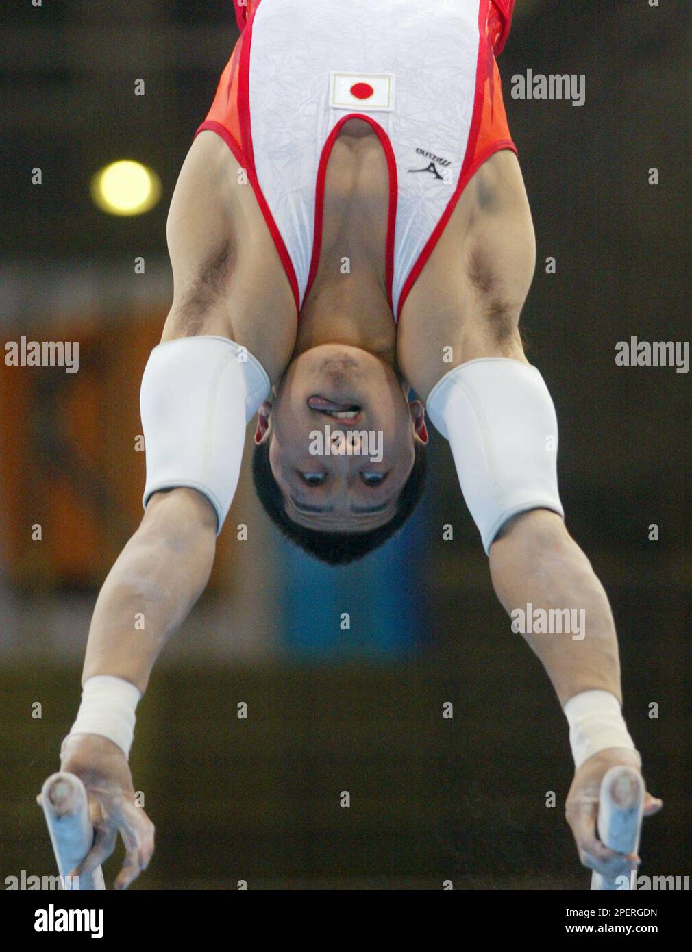 Japan's Daisuke Nakano performs his routine on the parallel bars during men's gymnastics ...