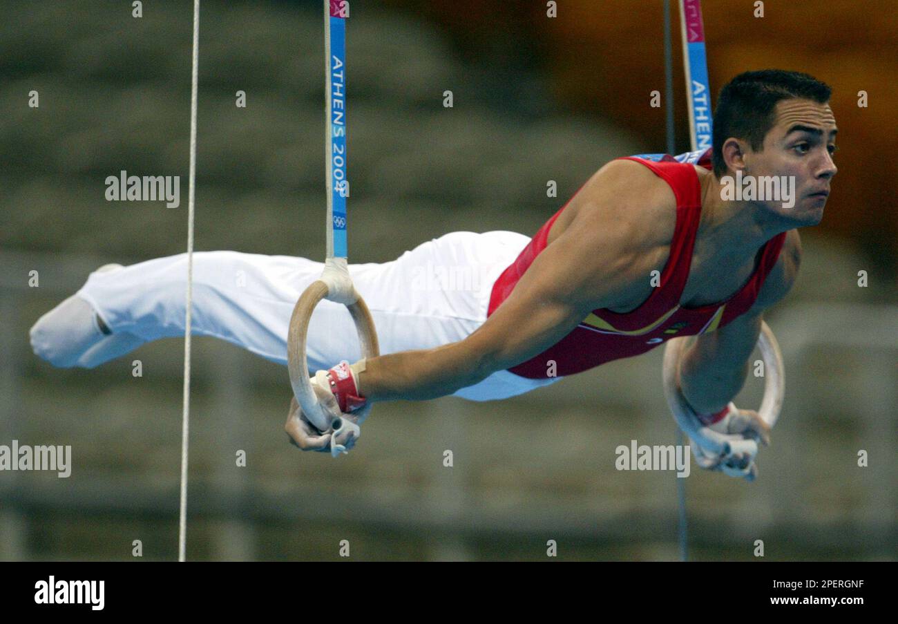 Rafael Martinez of Spain competes in the rings during the men's ...