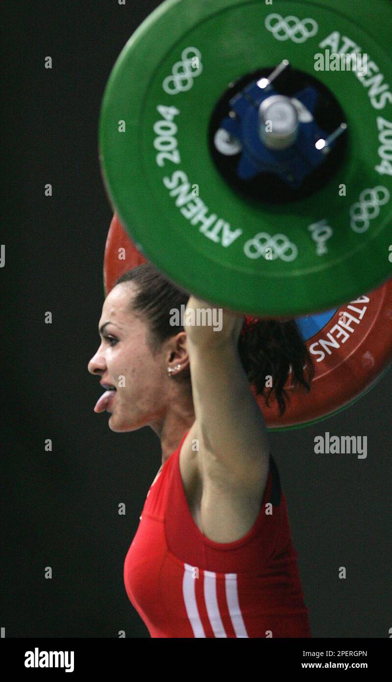 Nurcan Taylan of Turkey sticks out her tongue while competing during ...