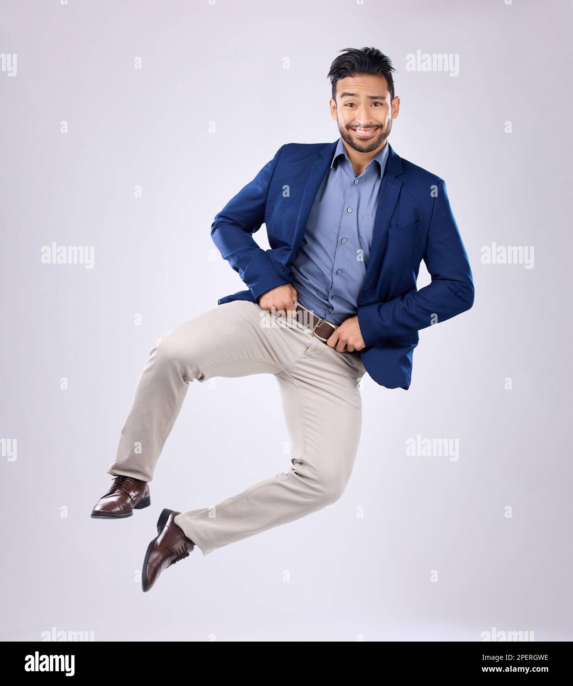 Happy, crazy and portrait of an Asian man jumping isolated on a white ...