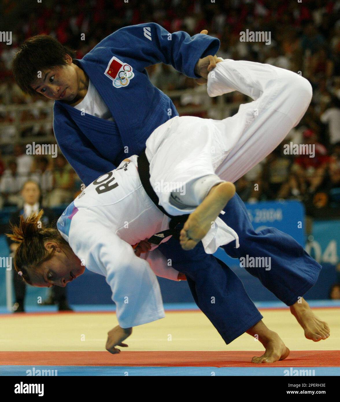 China's Gao Feng, top, throws Romania's Alina Alexandra Dumitru during the bronze medal match of ...