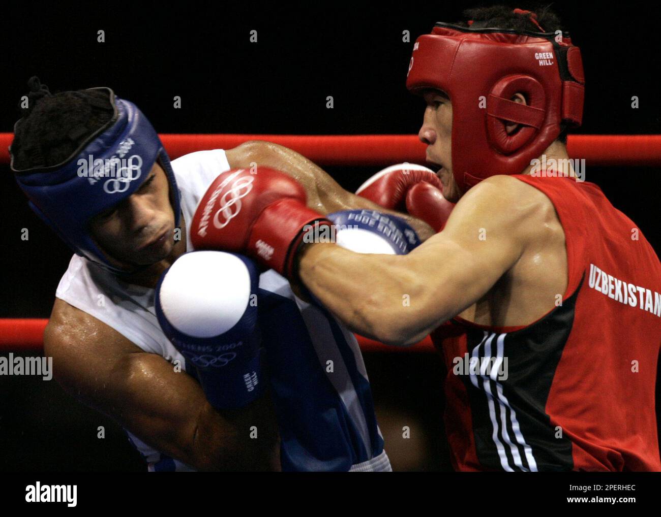 Uzbekistan's Sherzod Abdurahmonov, right, throws a punch on Turkey's ...