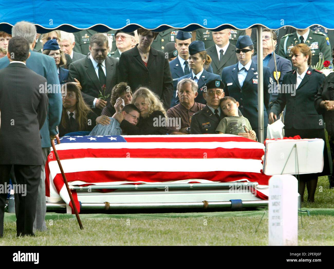Jill Turner, mother of SSgt. Craig W. Cherry, hugs Cherry's son Daniel ...