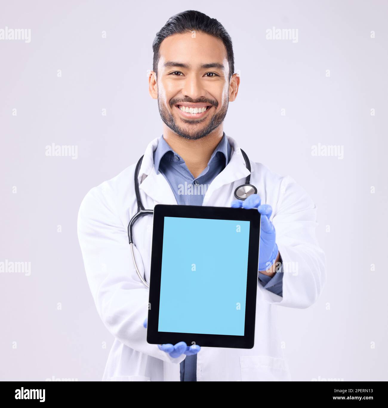 Tablet, green screen and doctor portrait isolated on a white background ...