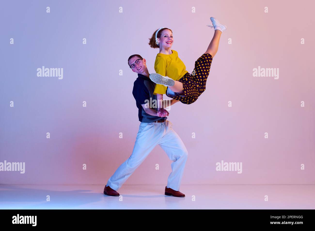 Attractive emotional young couple, man and woman in stylish clothes ...