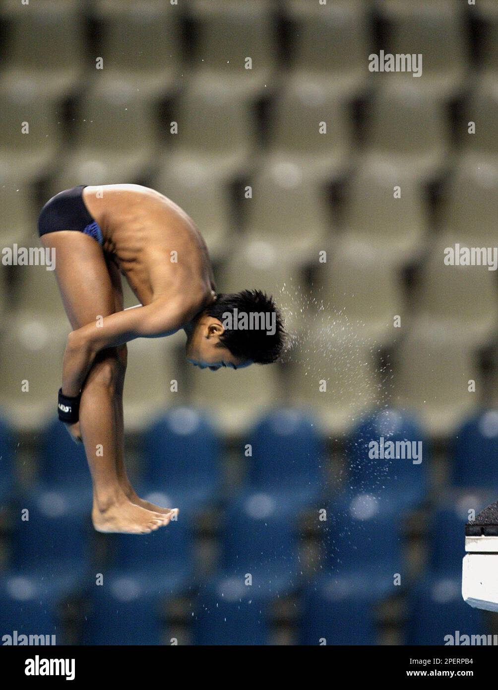 Fourteen-year-old diver Bryan Nickson Lomas, dives during a practice ...