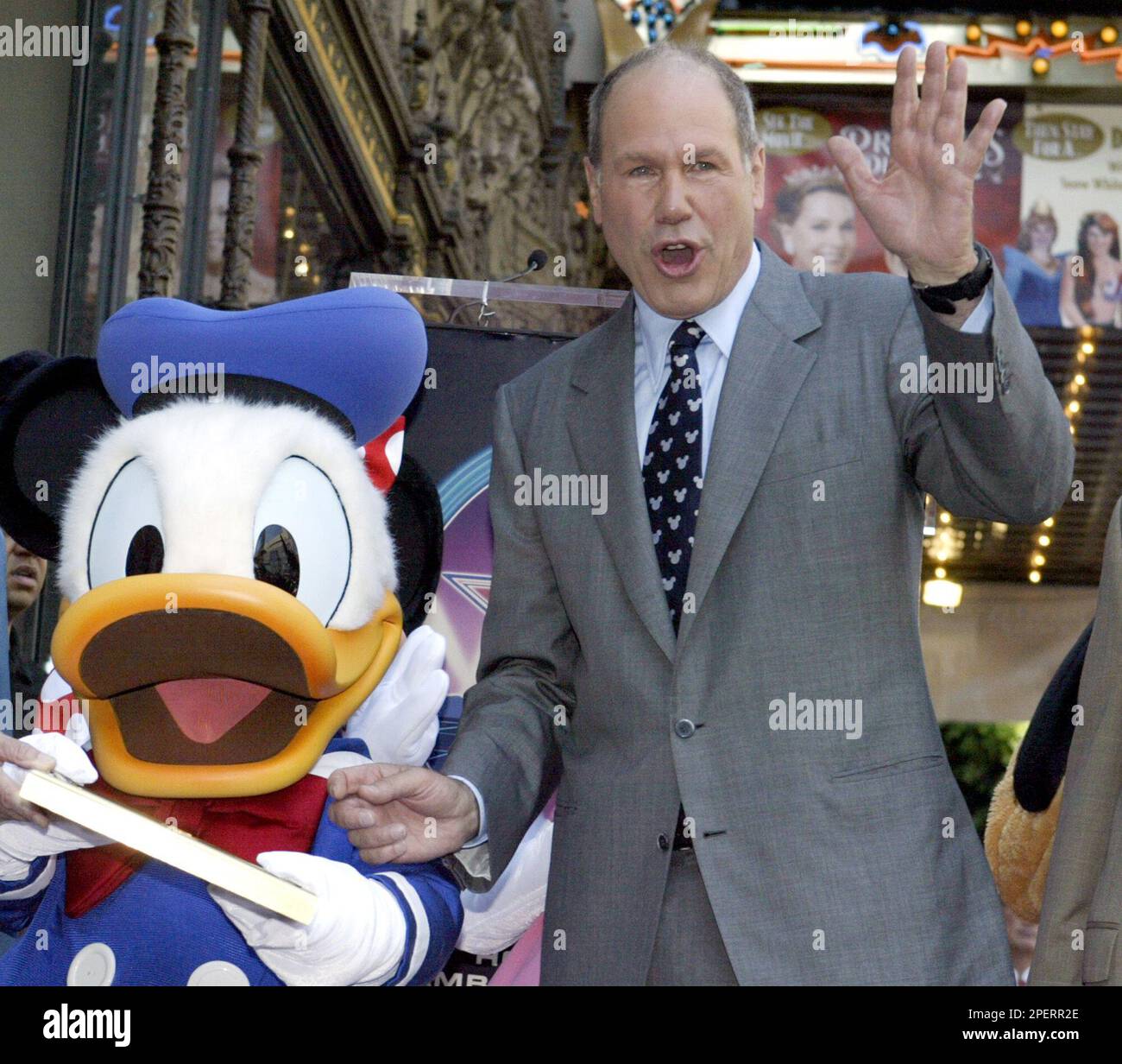 Michael Eisner, CEO of The Walt Disney Company waves to the crowd with ...