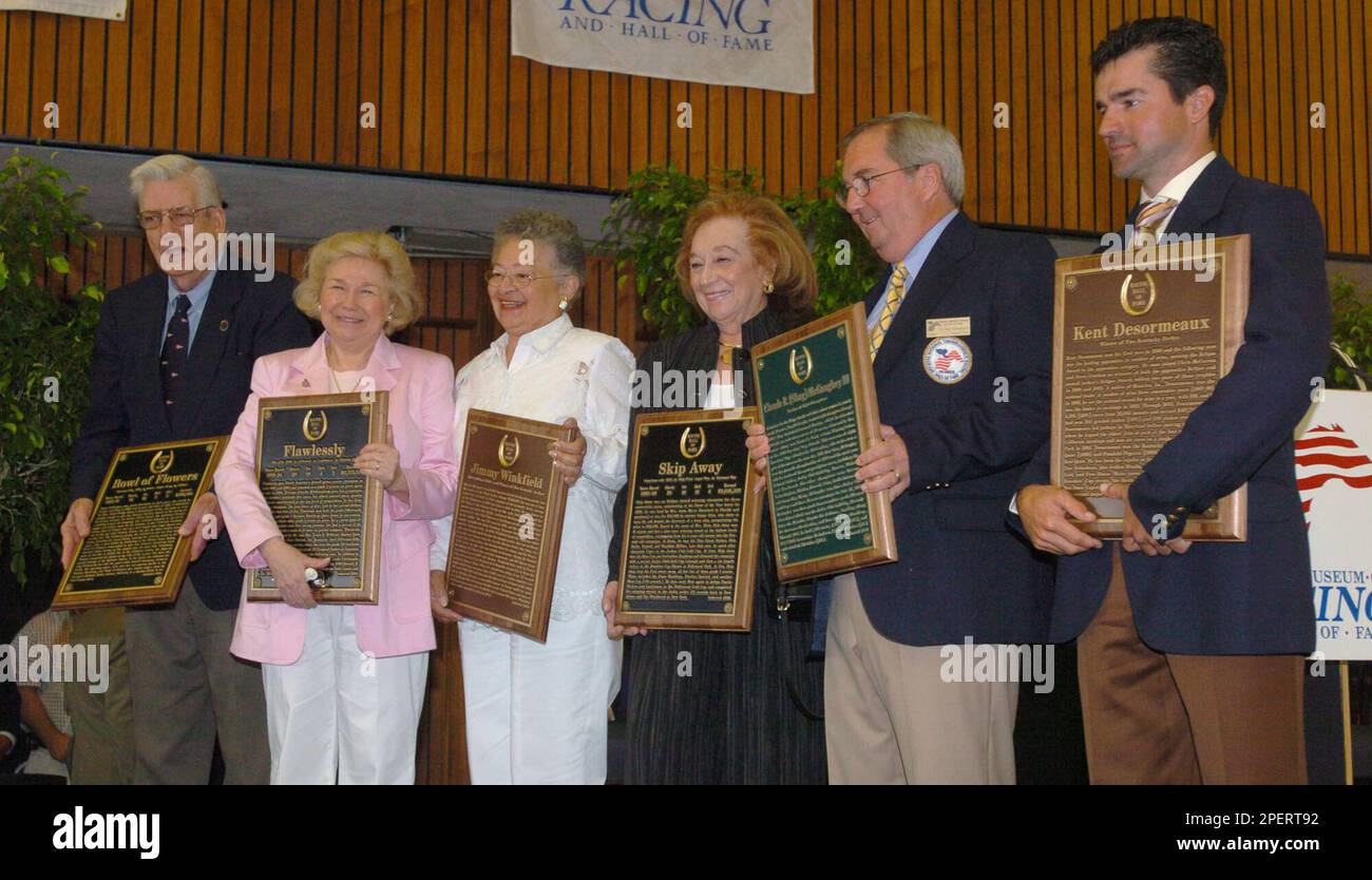 Honorees hold their plaques at induction ceremonies for the Official ...