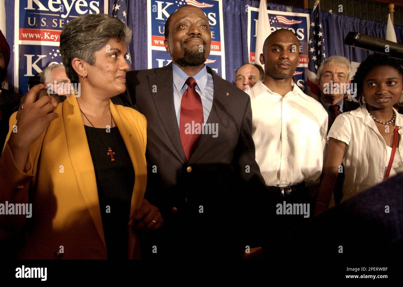 Jocelyn Keyes, wife of Alan Keyes grasps his hand after Keyes accepts ...