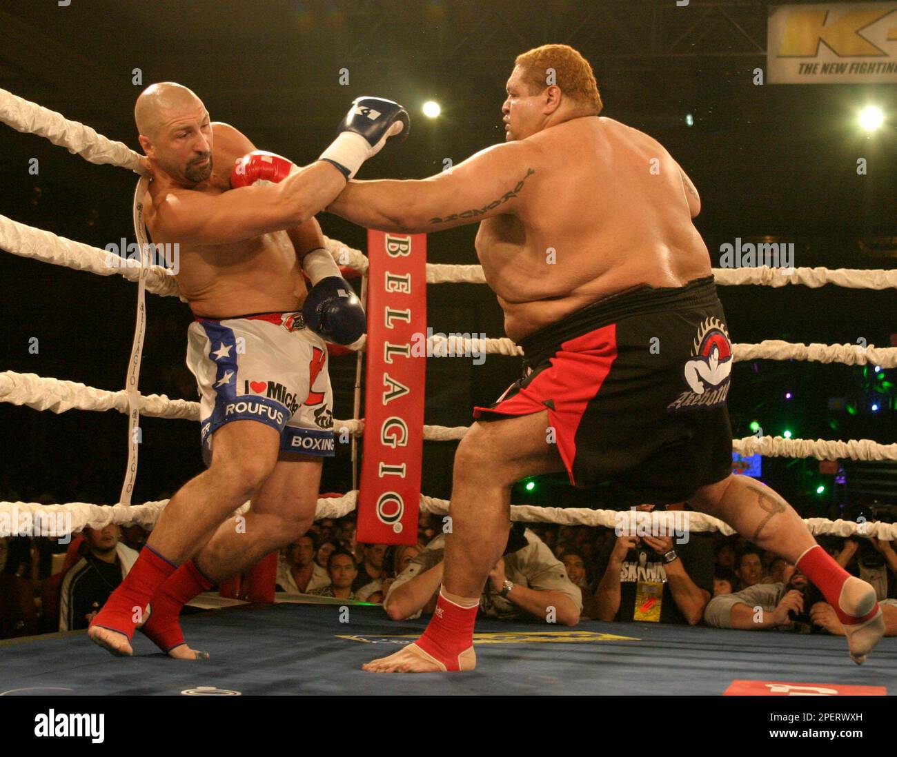 Rick Roufus, left, is hit by Taro Akebono, of Japan, during the first ...