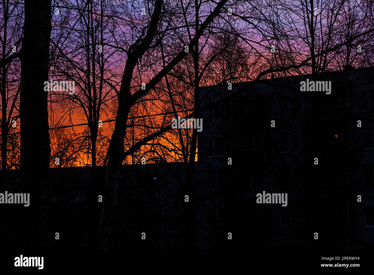 Real deep colours sunset sky and silhouette of some house Stock Photo ...